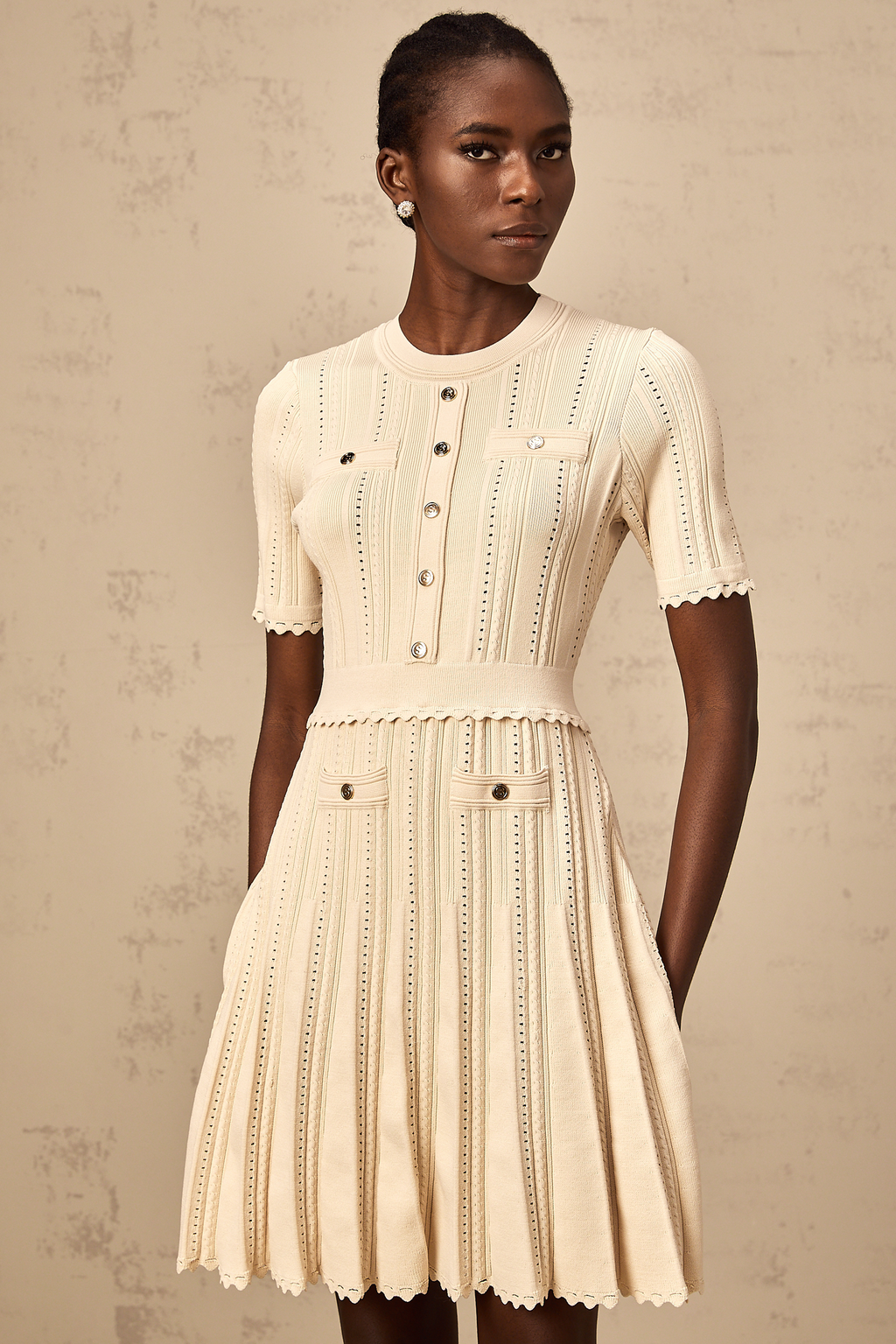 Amélie neutrals pointelle-trim pleated knit mini dress